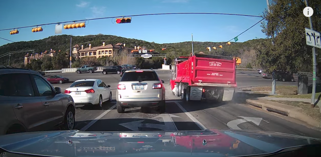 Out Of Control Dump Truck Plows Through Intersection