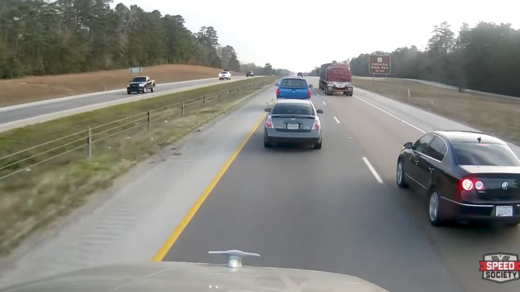 Car Tries To Merge In Front Of Semi Truck But The Trucker Isn’t Having it