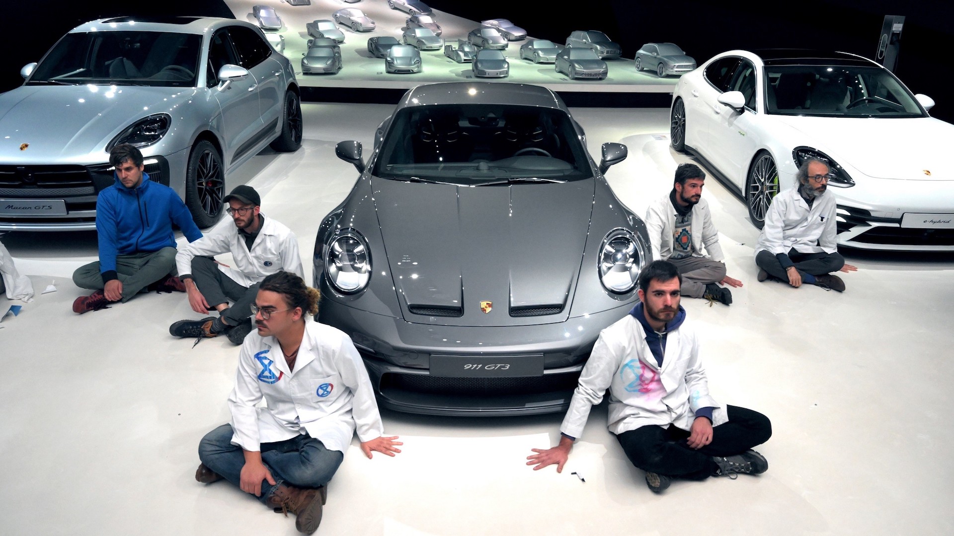Eco-Protesters Glue Themselves to the Volkswagen Showroom Floor, Until ...